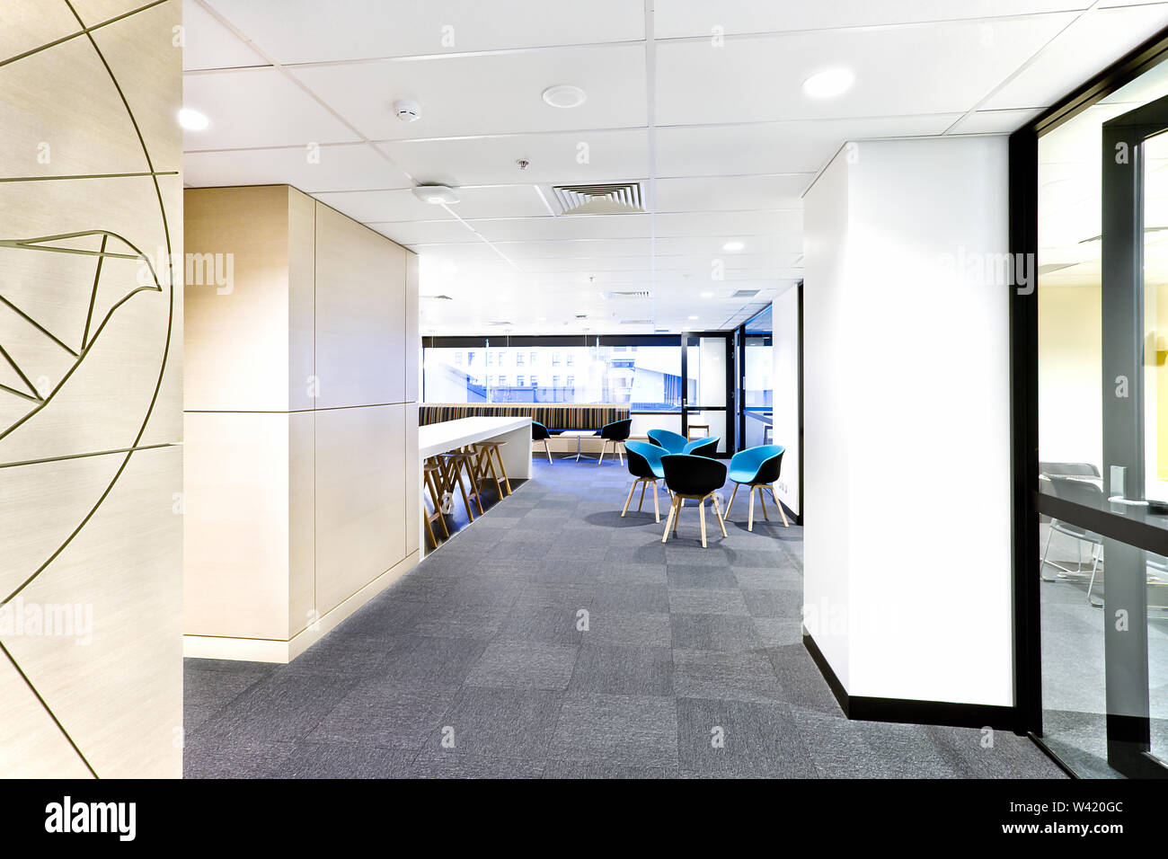 Modern eating place with chairs and white walls next glass door Stock ...