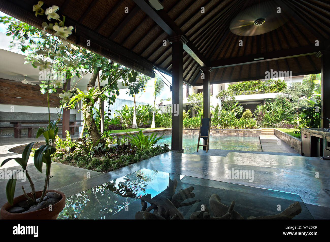 Outside areas like veranda in front of a pool with the traditional ...