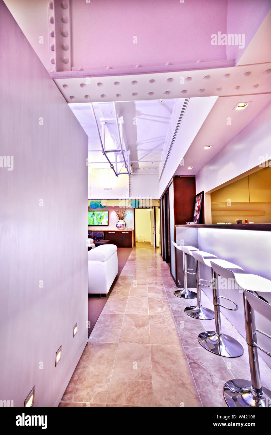 Bar with chairs and tables, hot pink themed club, a view from the bar ...