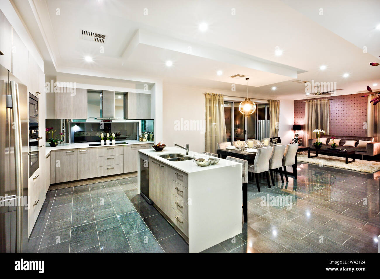 Modern and shiny kitchen with dining and living area, including a ...