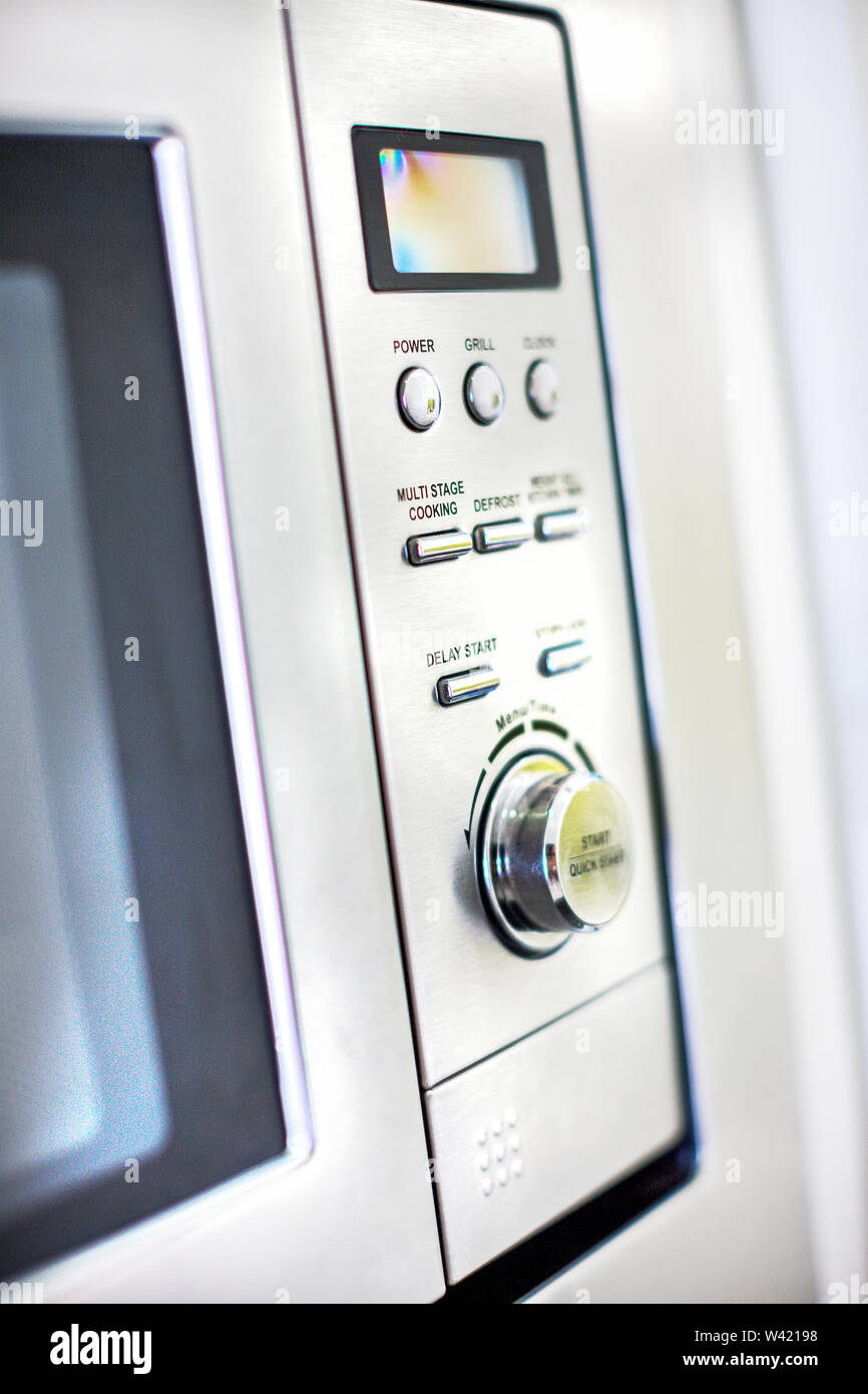 An electronic oven with multiple controls Stock Photo - Alamy