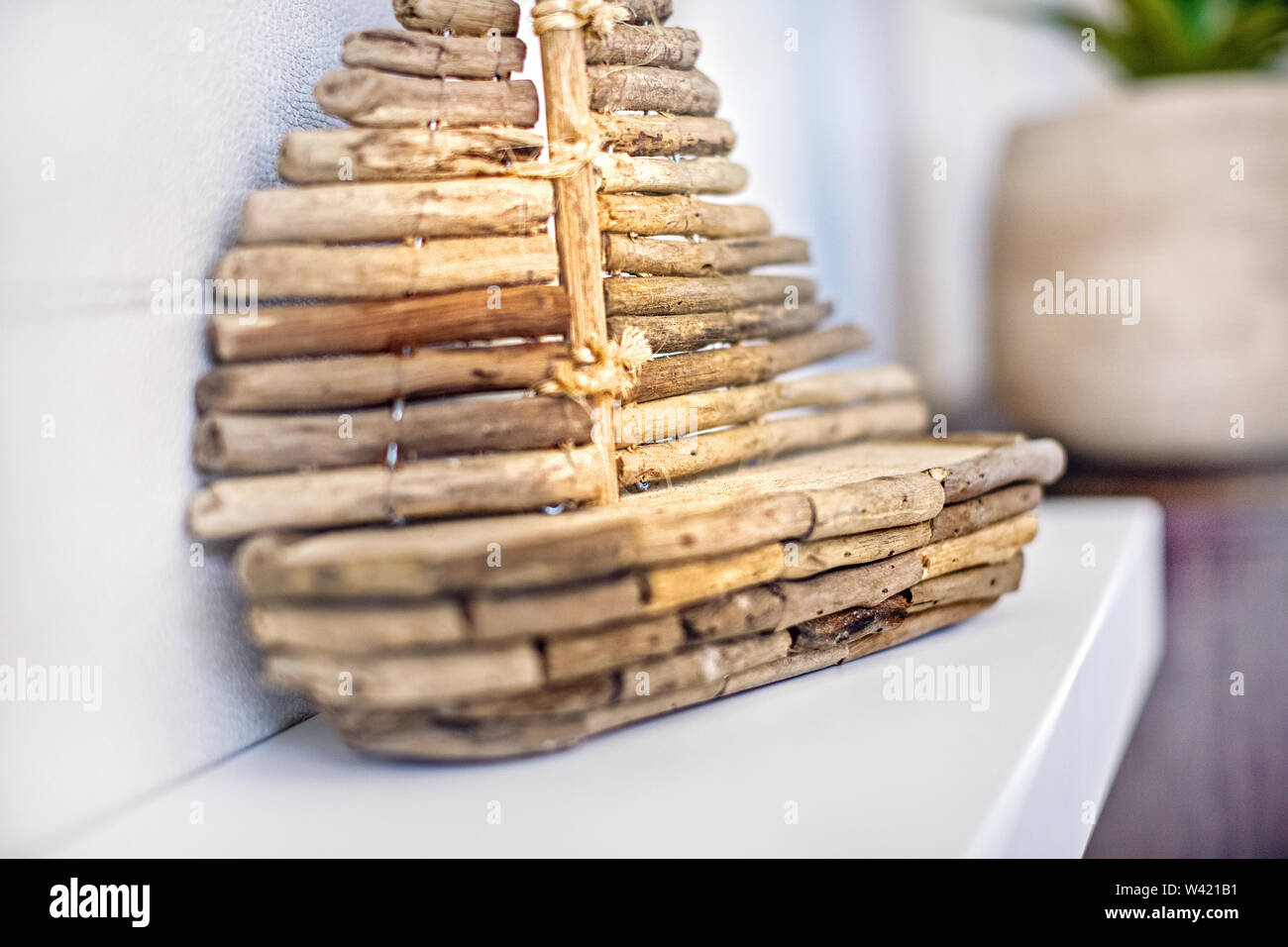 Artistic sailboat model made of wood pieces, wire, and rope Stock Photo ...