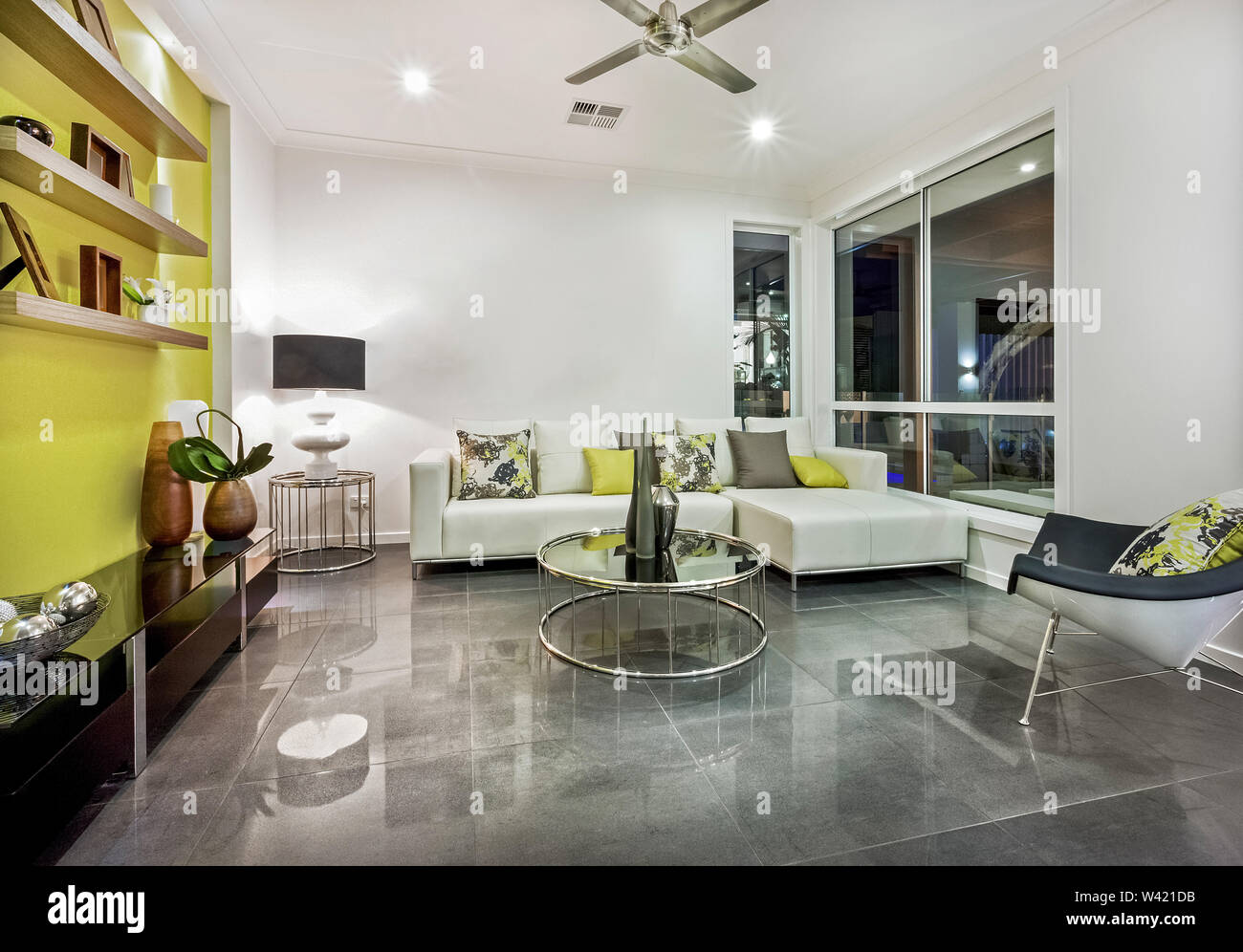 Well-organized living space with shelves, console table, center table ...