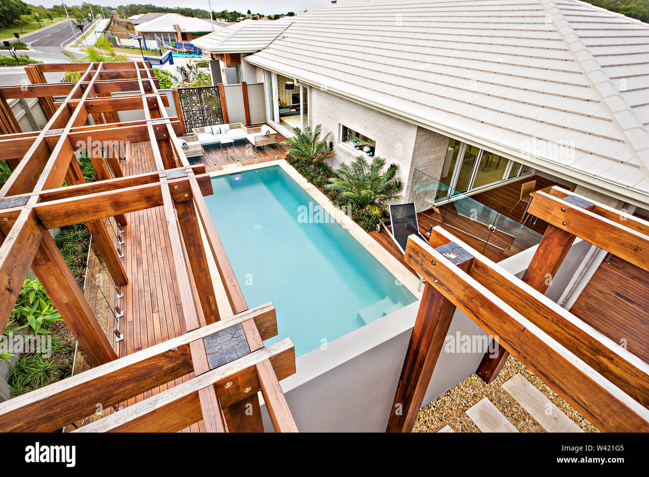 Top view of the wooden pillars and beams of a modern pool in a hotel or ...
