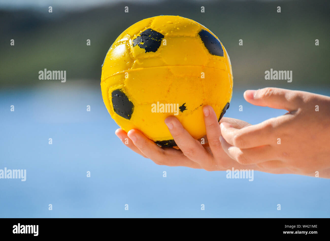 Hands with soccer ball hi-res stock photography and images - Alamy