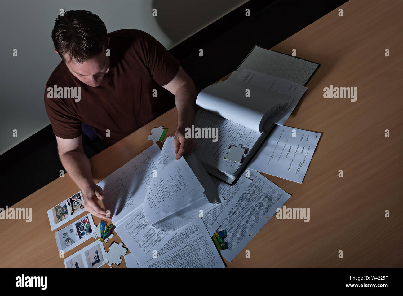 Top view of a man study book and papers on the table at a school or ...
