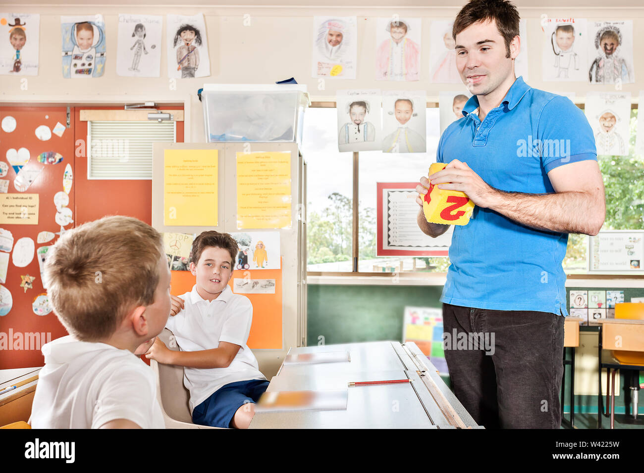 Elementary students man read classroom hi-res stock photography and ...