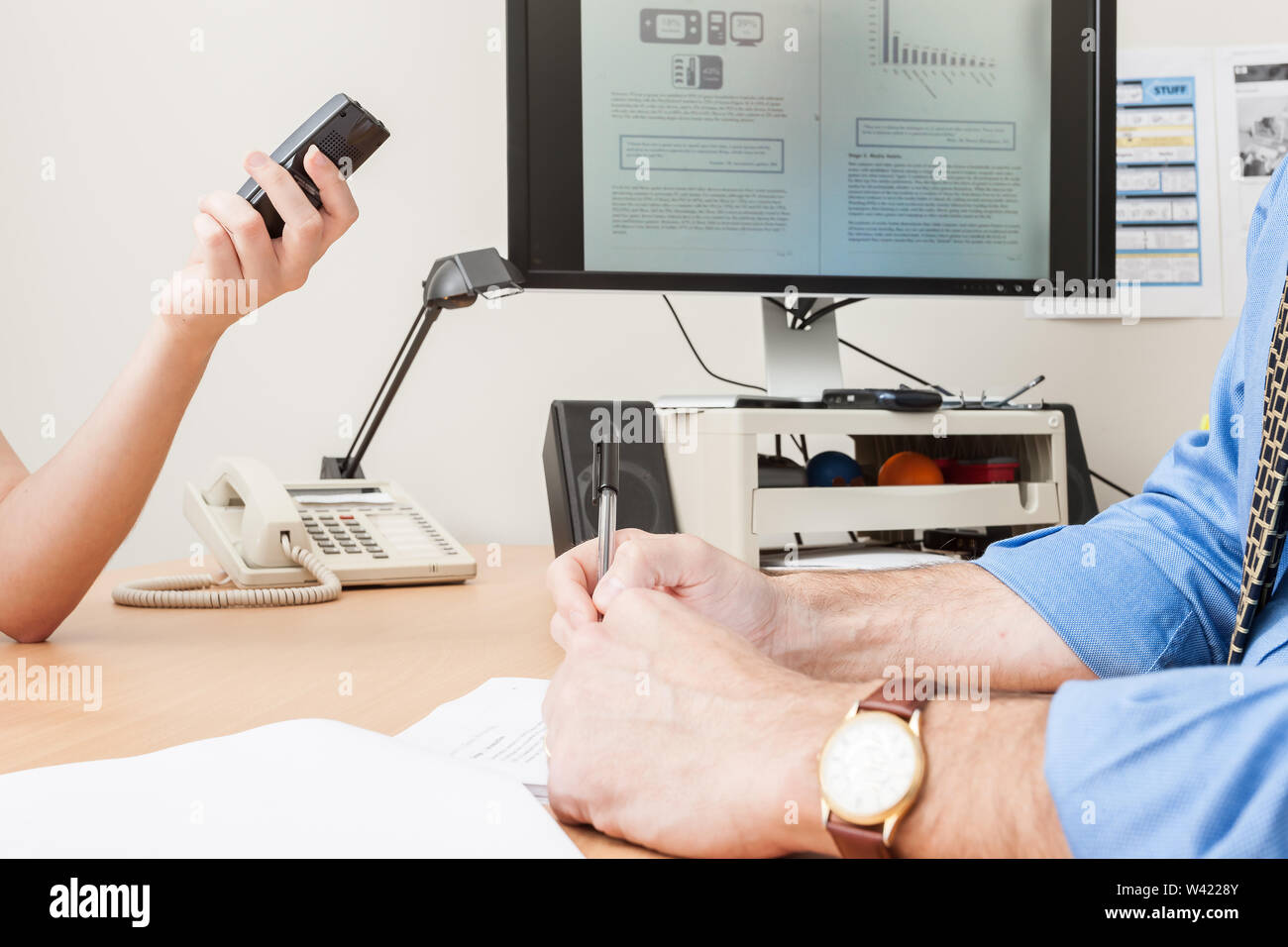 Hand with a recording device taking a voice cut in a room Stock Photo ...