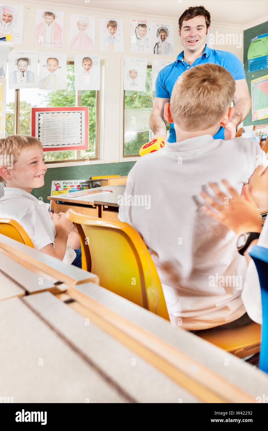 Back view of class students in the class with teachers and clap Stock ...