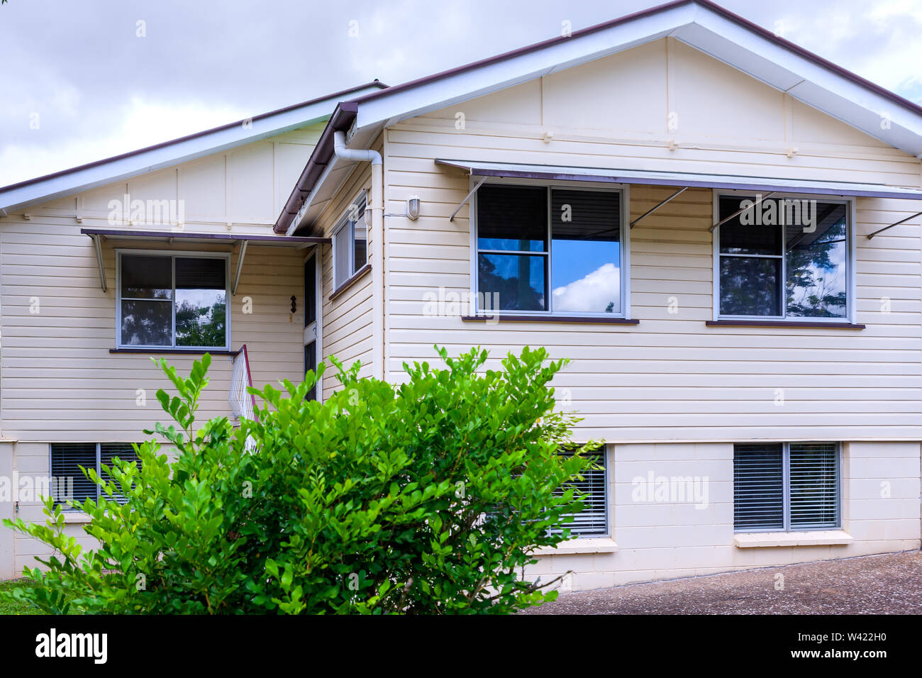Facade of a regular size, simple house Stock Photo - Alamy