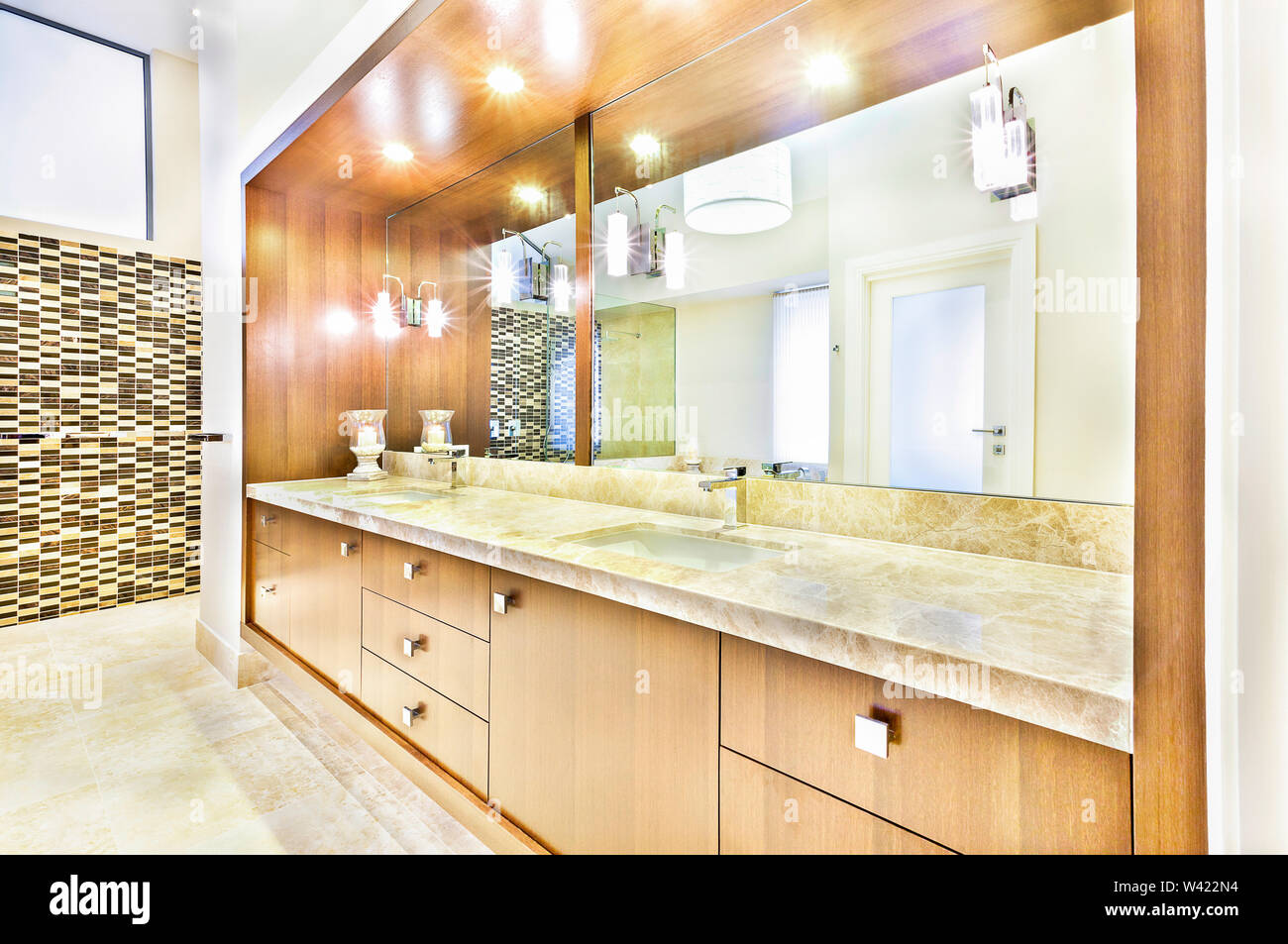 Wooden table with mirror in wash room, very clean place, some designs ...