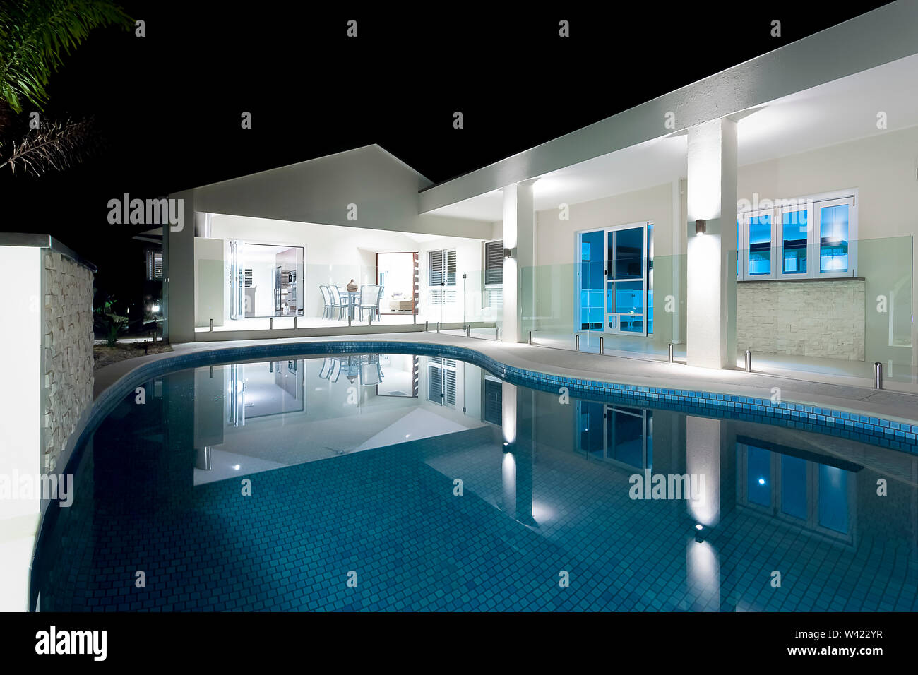Clear blue water round swimming pool of a modern hotel or house at ...
