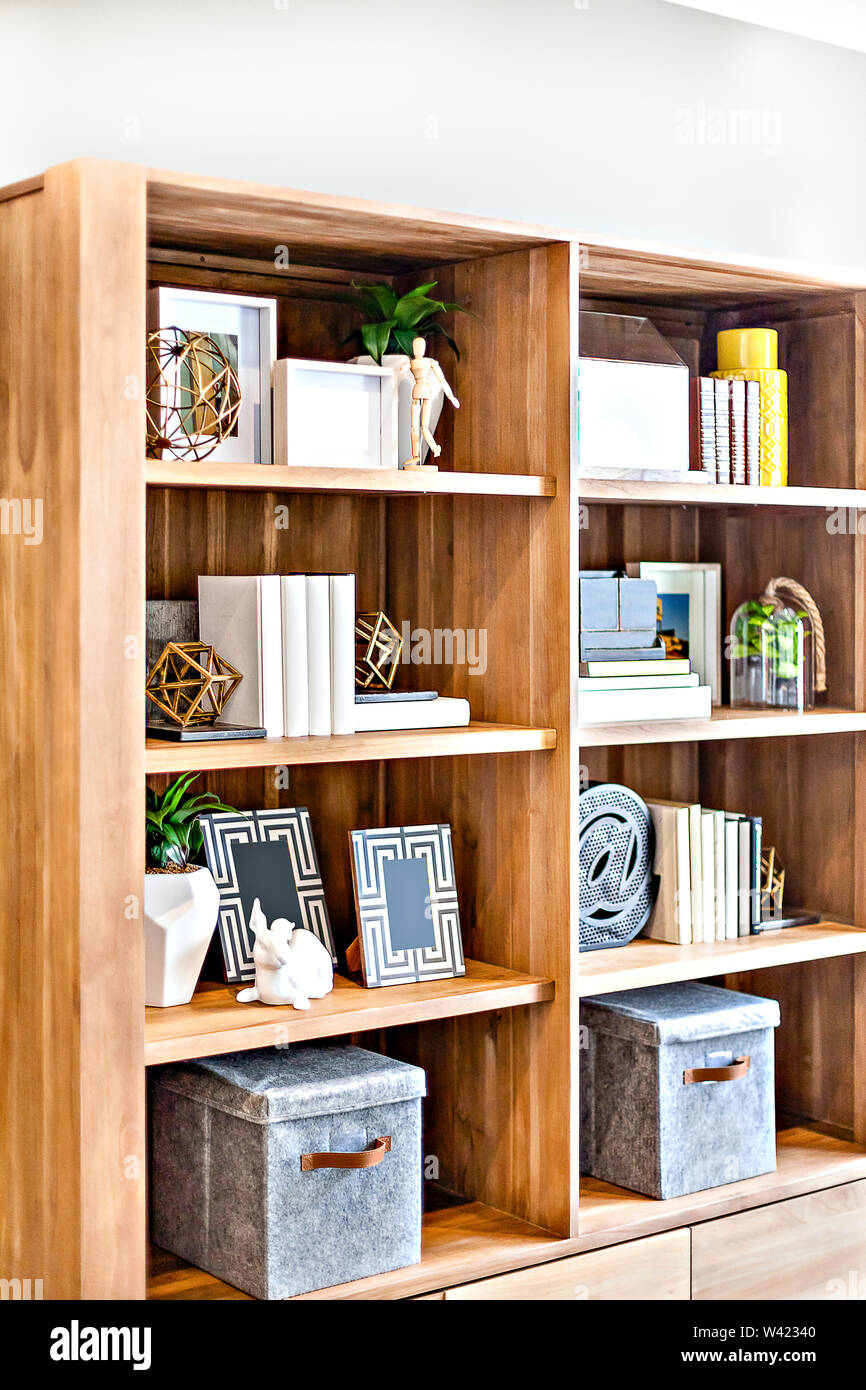 Old wooden shelf with fancy and antique items like old boxes and books ...