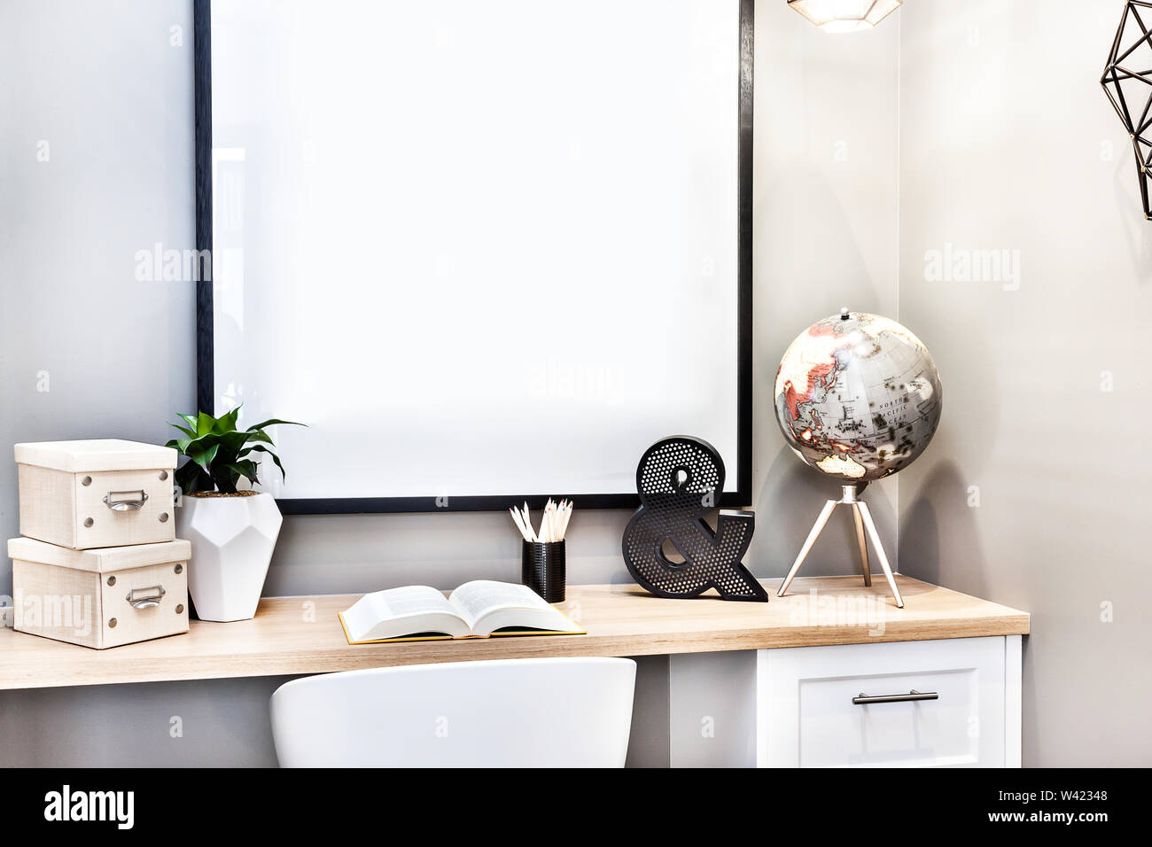Closeup of a modern study room with globe and boxes beside 3d letters ...