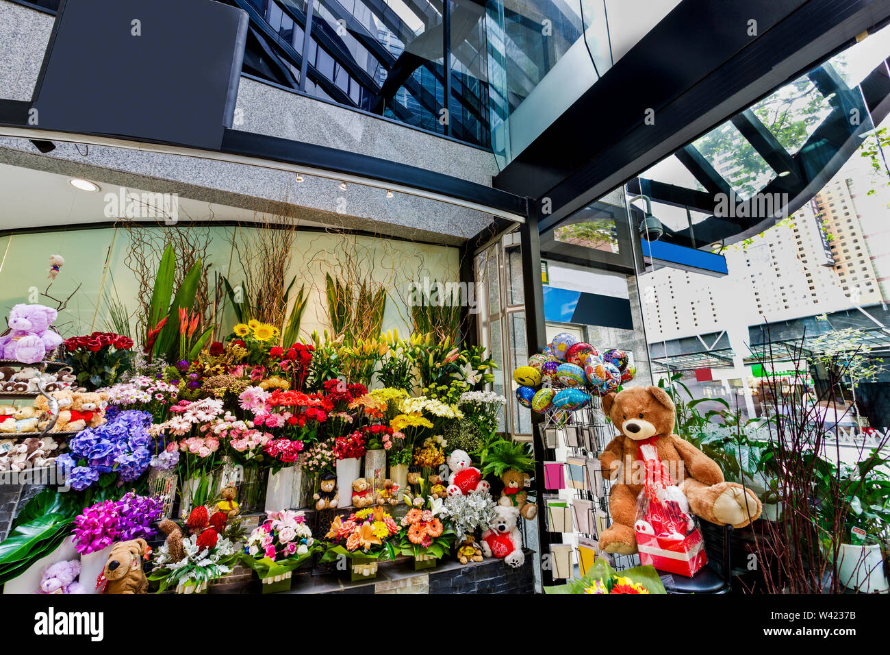 Flower and gift shop with teddy bears around the glass walls, there are ...