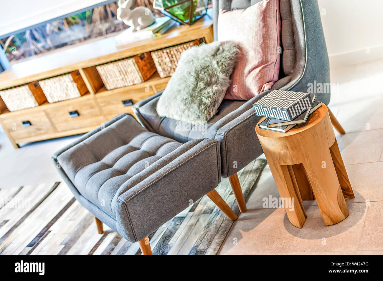 Modern restroom with a cushion sofa and pillows with wool beside round ...