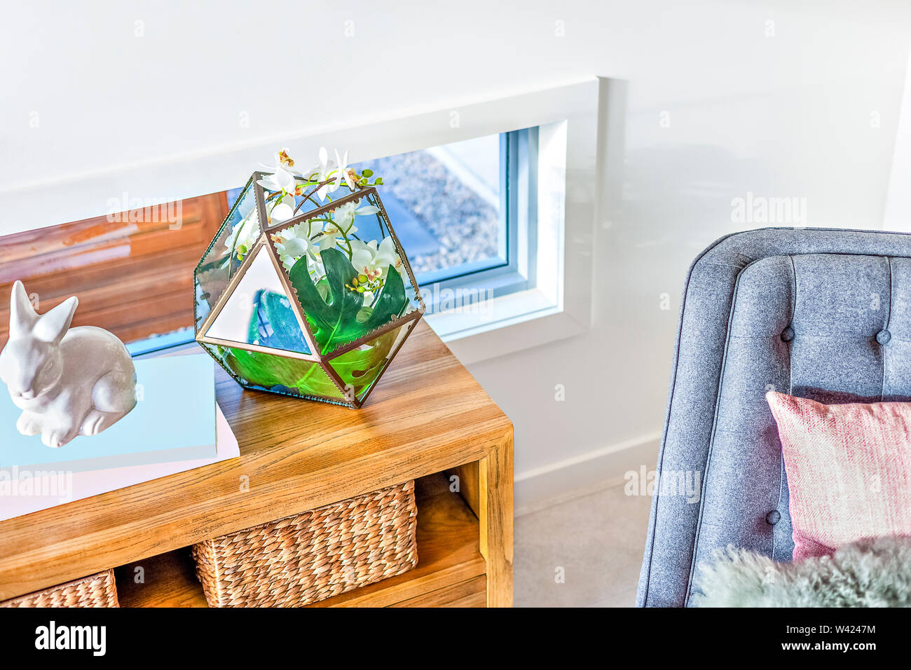 Modern living room with fancy items like rabbit statue and eight bevel ...