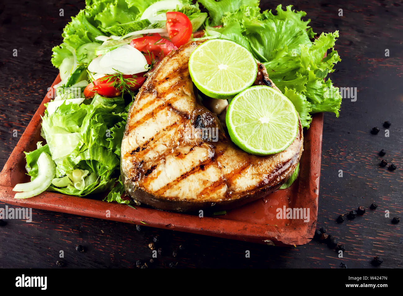 Grilled Fish Fillet with Vegetables in the plate Stock Photo - Alamy