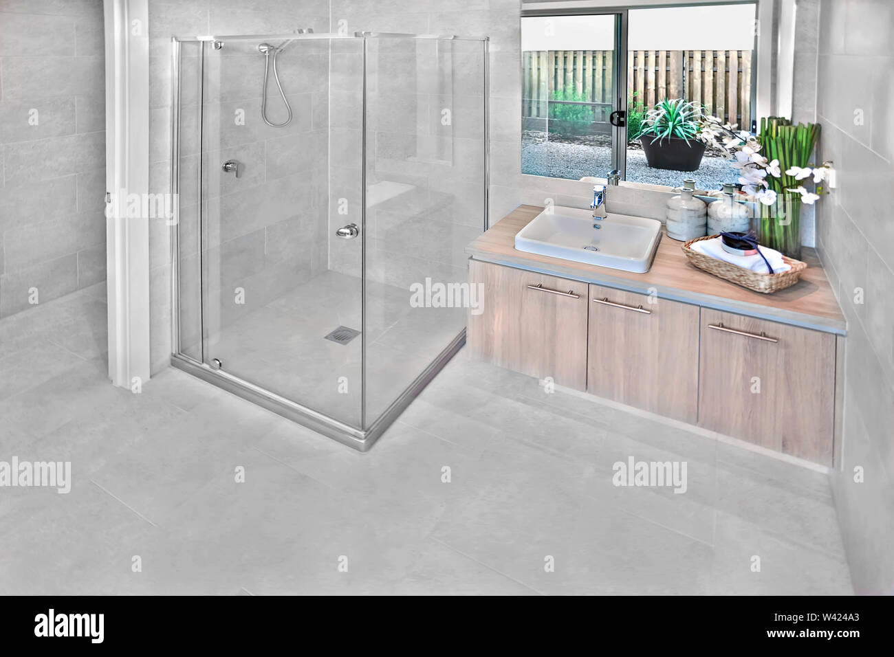 Top view of the modern bathroom with a shower white sink and tap next ...