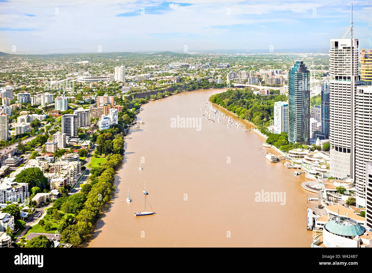 Riverside town with buildings and green gardens, beautiful lake have ...