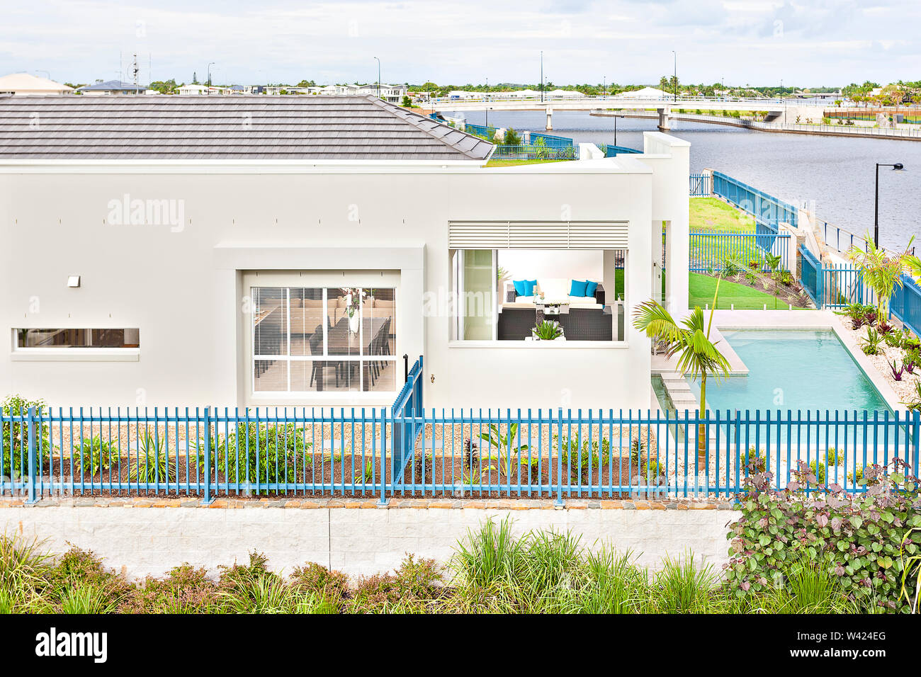 Colorful garden with modern home near riverside, natural looking scene ...