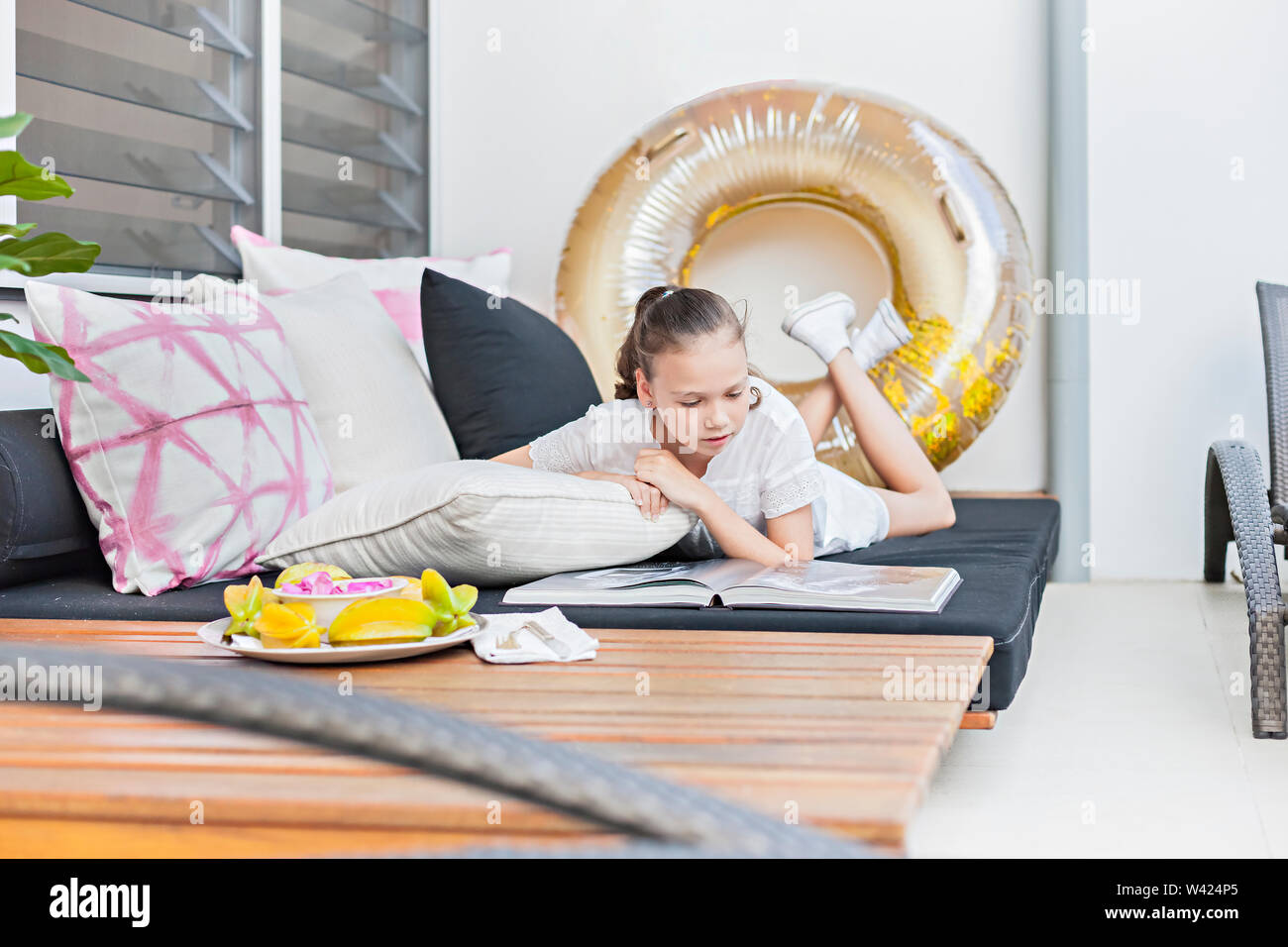 Student reading magazine at desk hi-res stock photography and images ...