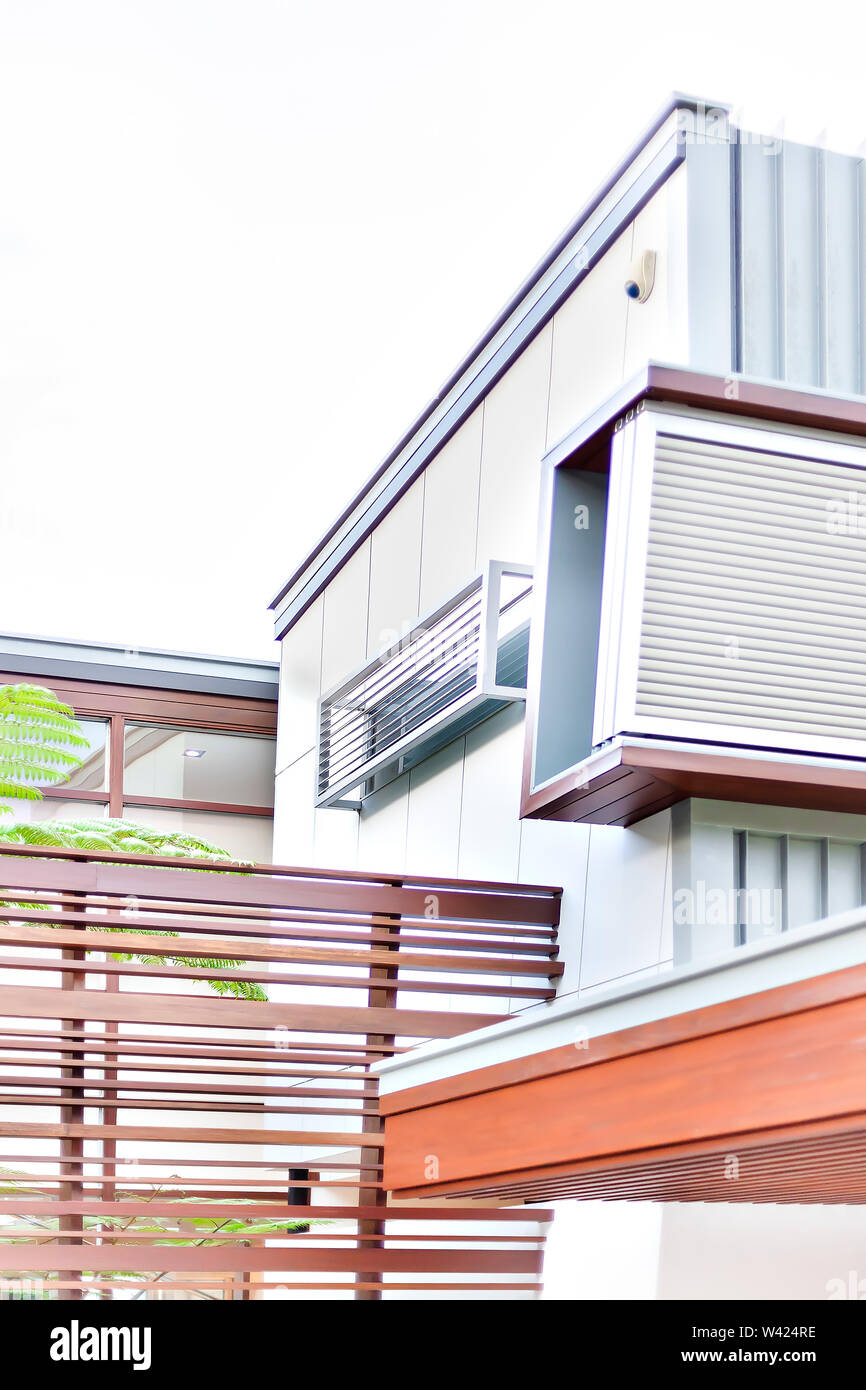 Modern house or hotel front side with a wooden fence and ceiling can be ...