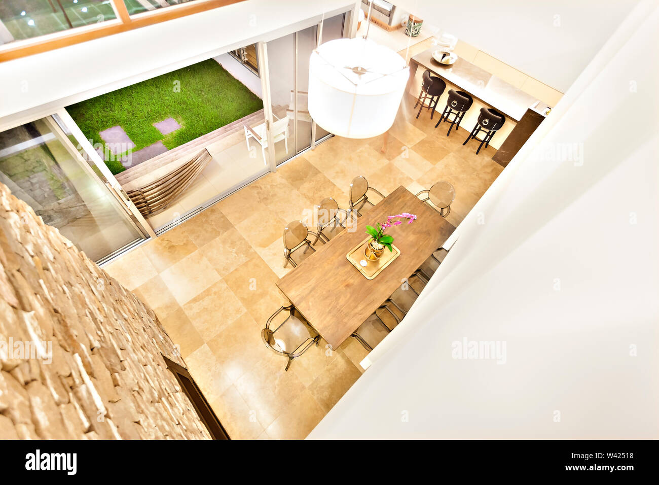 High angle view from upstairs to the patio area with outdoor entrance ...