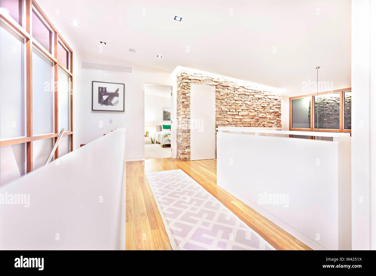Wooden hallway through the upstairs with the illumination of lights at ...