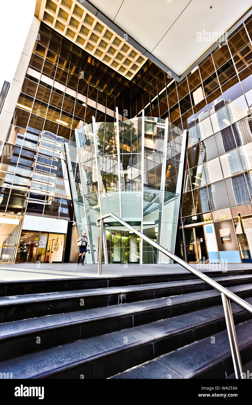Stairs to a creative glass entrance of a luxury building also made in ...