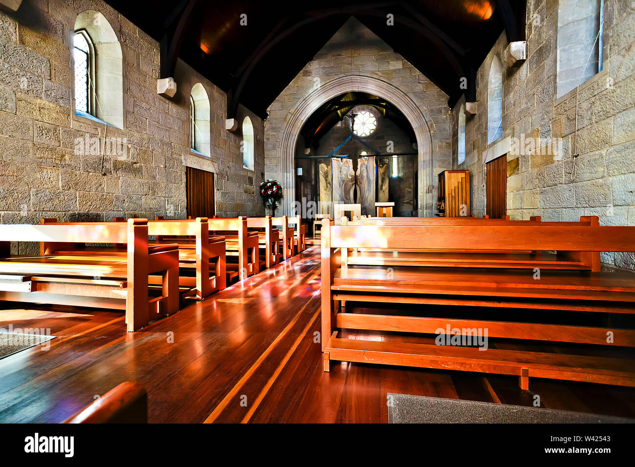 Old room with wooden chairs and stone walls with old architecture ...
