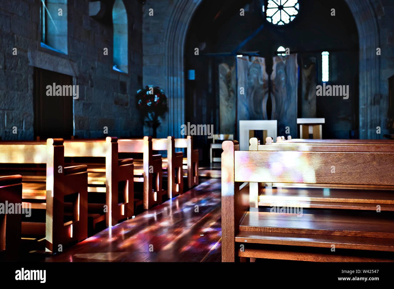Church room with wooden chairs with old look design with stone walls ...