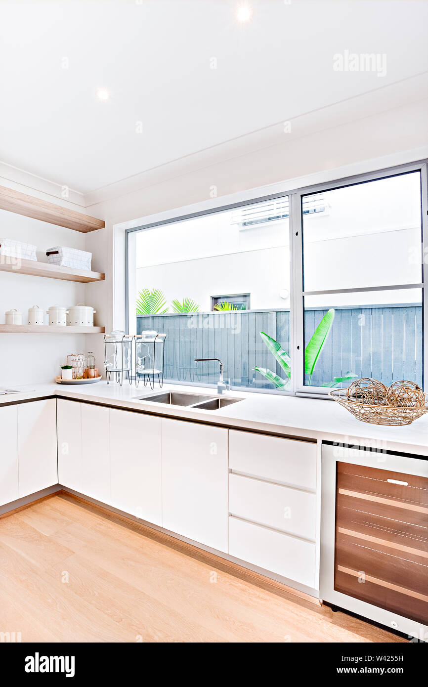 Modern kitchen counter with store oven and ingredients racks on the ...