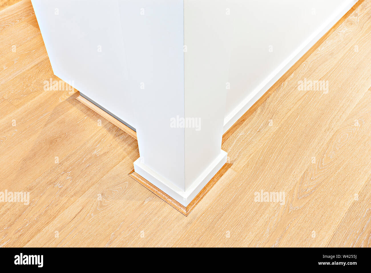 House interior with wooden floor close up and white pillar wall ...