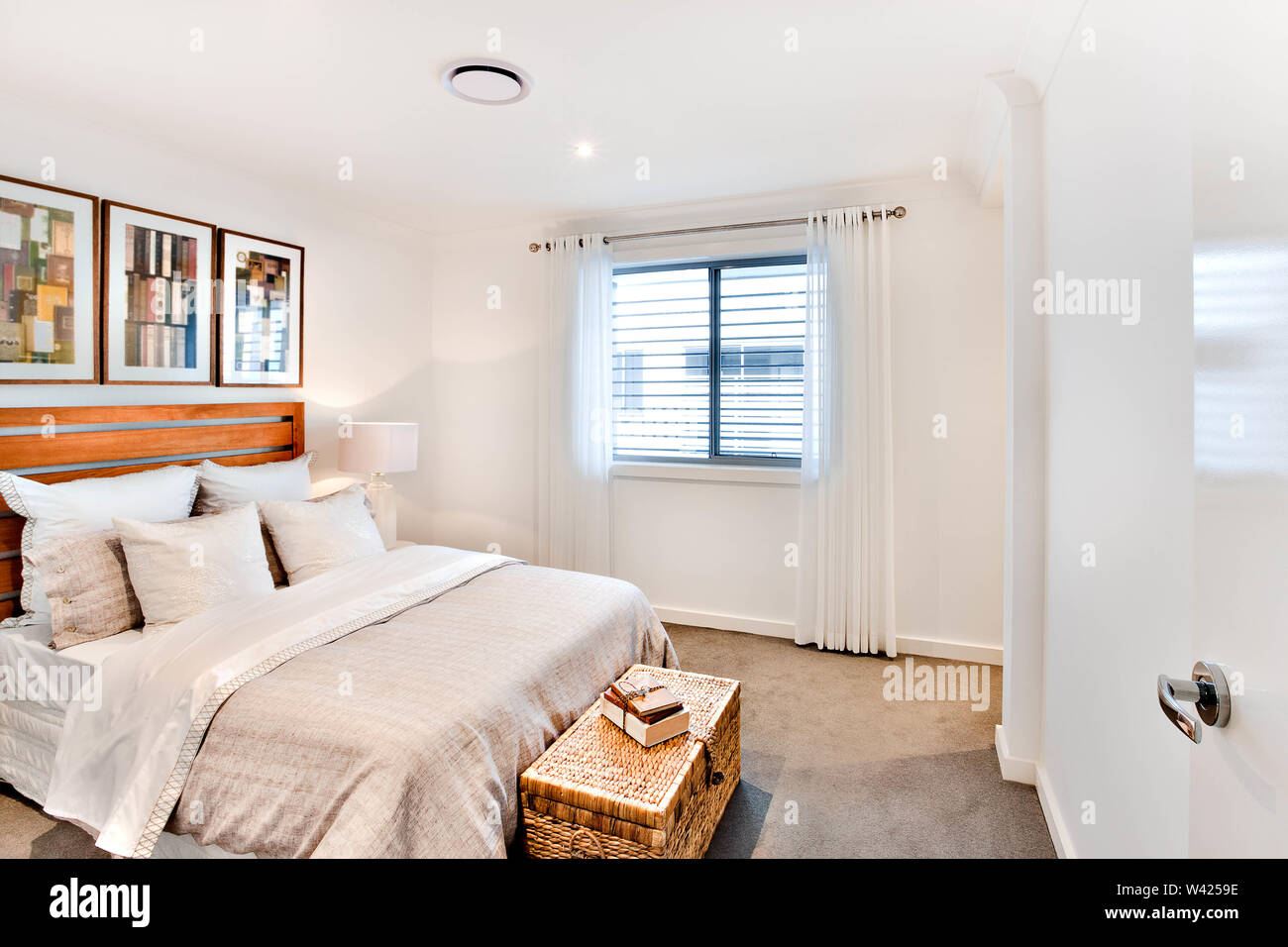 Bed close up the entrance with a window with the sunlight spread in the ...