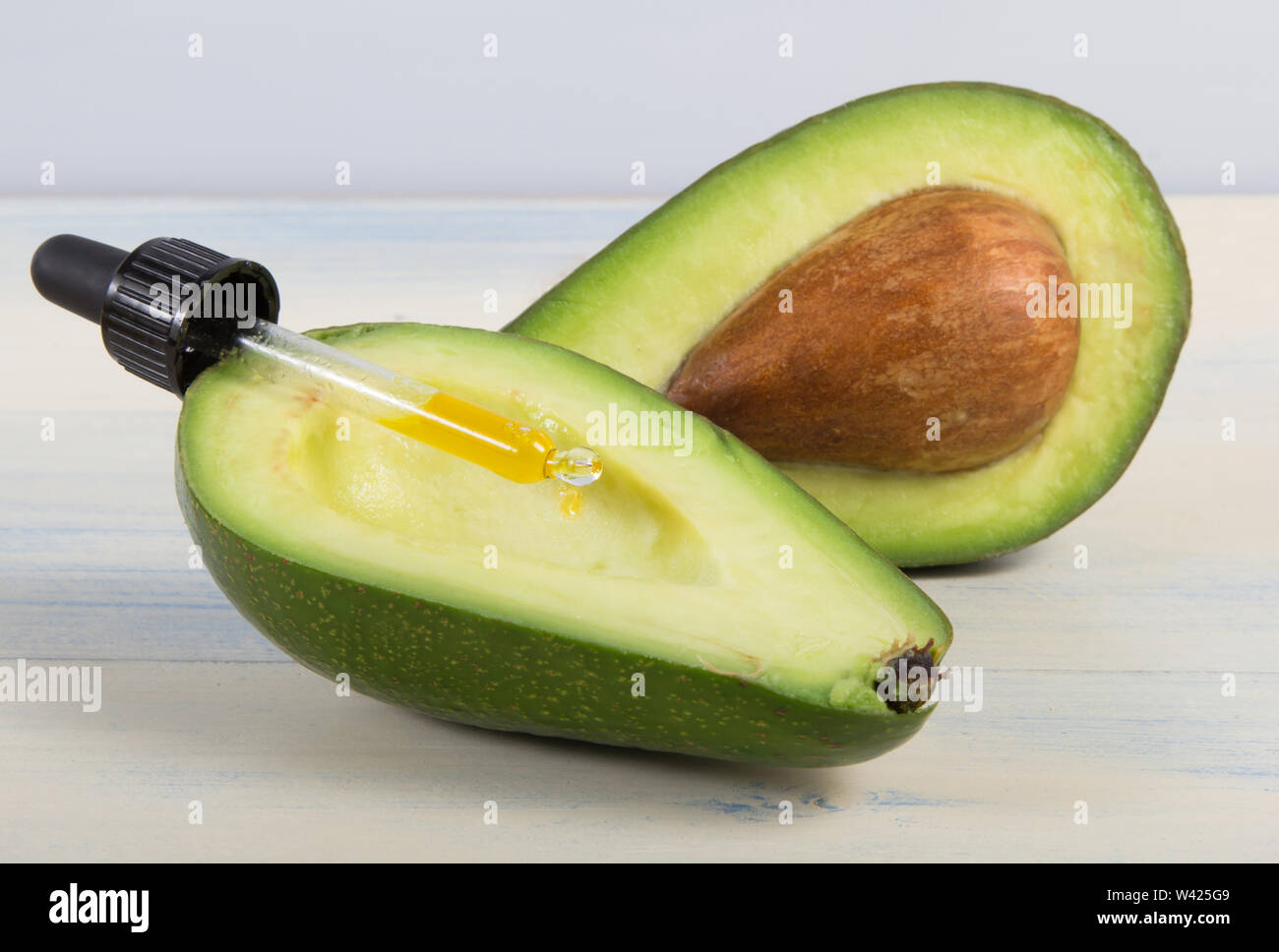 Avocado fruit and oil Stock Photo - Alamy