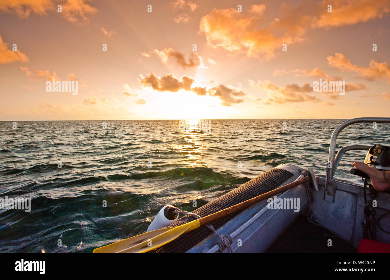 Sunset on the sea with a slightly cloudy sky Stock Photo - Alamy