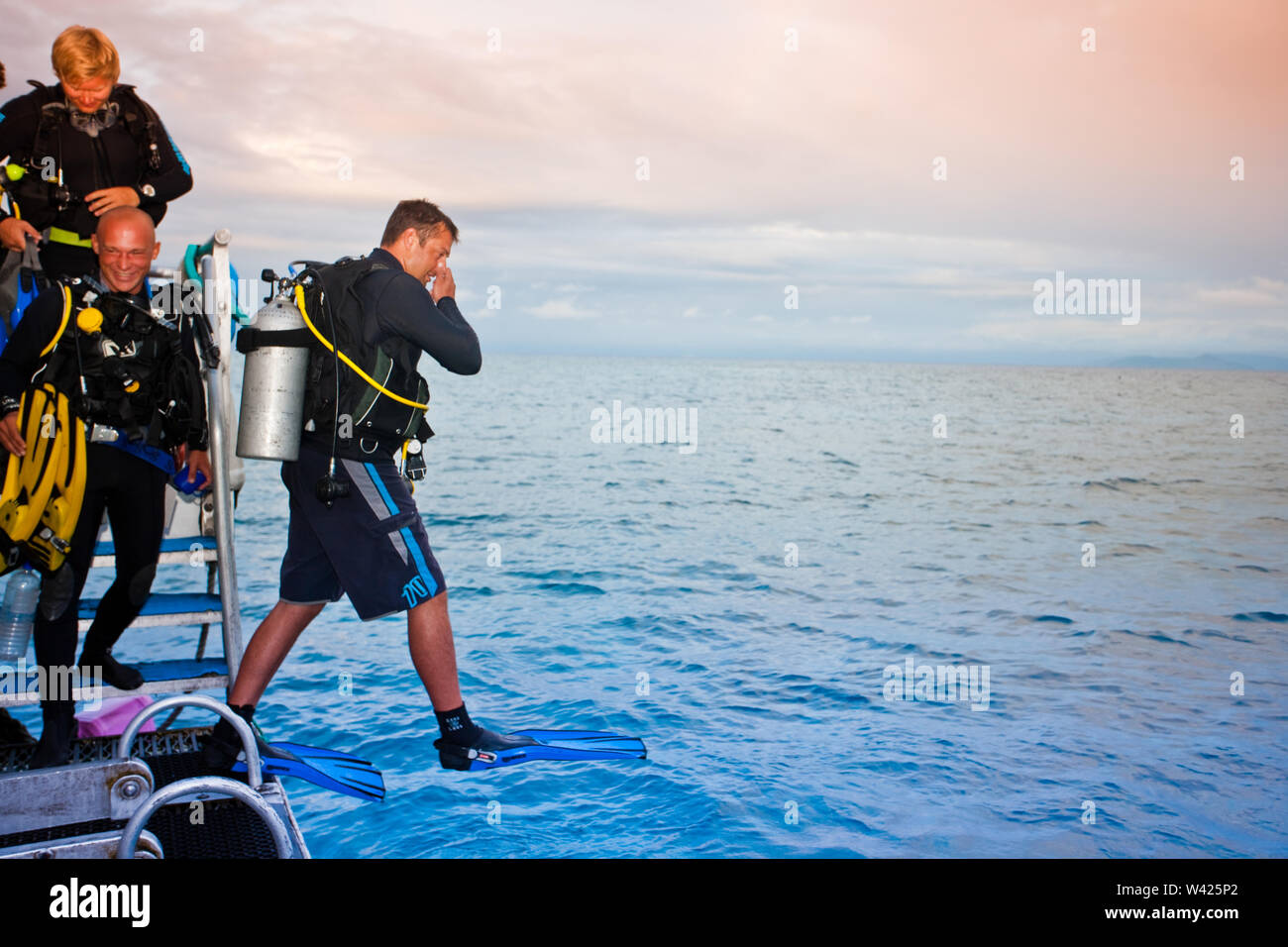 A man diving in the sea on a clear day Stock Photo - Alamy