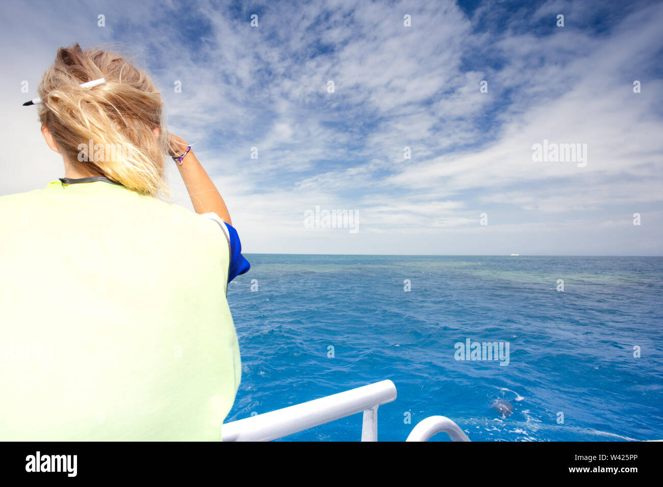 A female diving lookout keeping an eye on the divers Stock Photo - Alamy