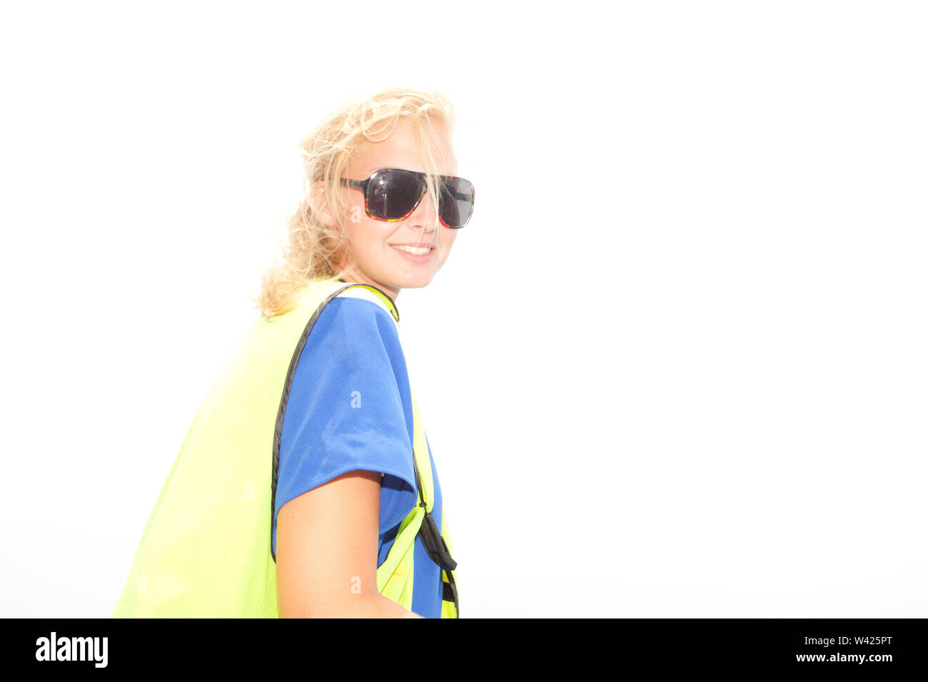 A smiling young woman with a life jacket and goggles on Stock Photo - Alamy