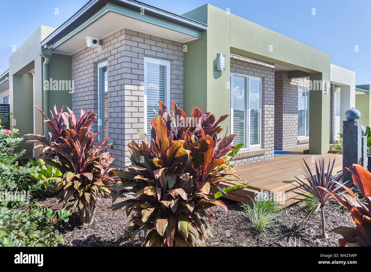 Creative house outdoor view with garden, sky is blue and no clouds can ...