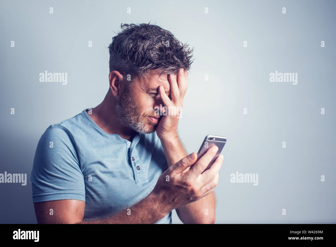 Sad man phone hi-res stock photography and images - Alamy