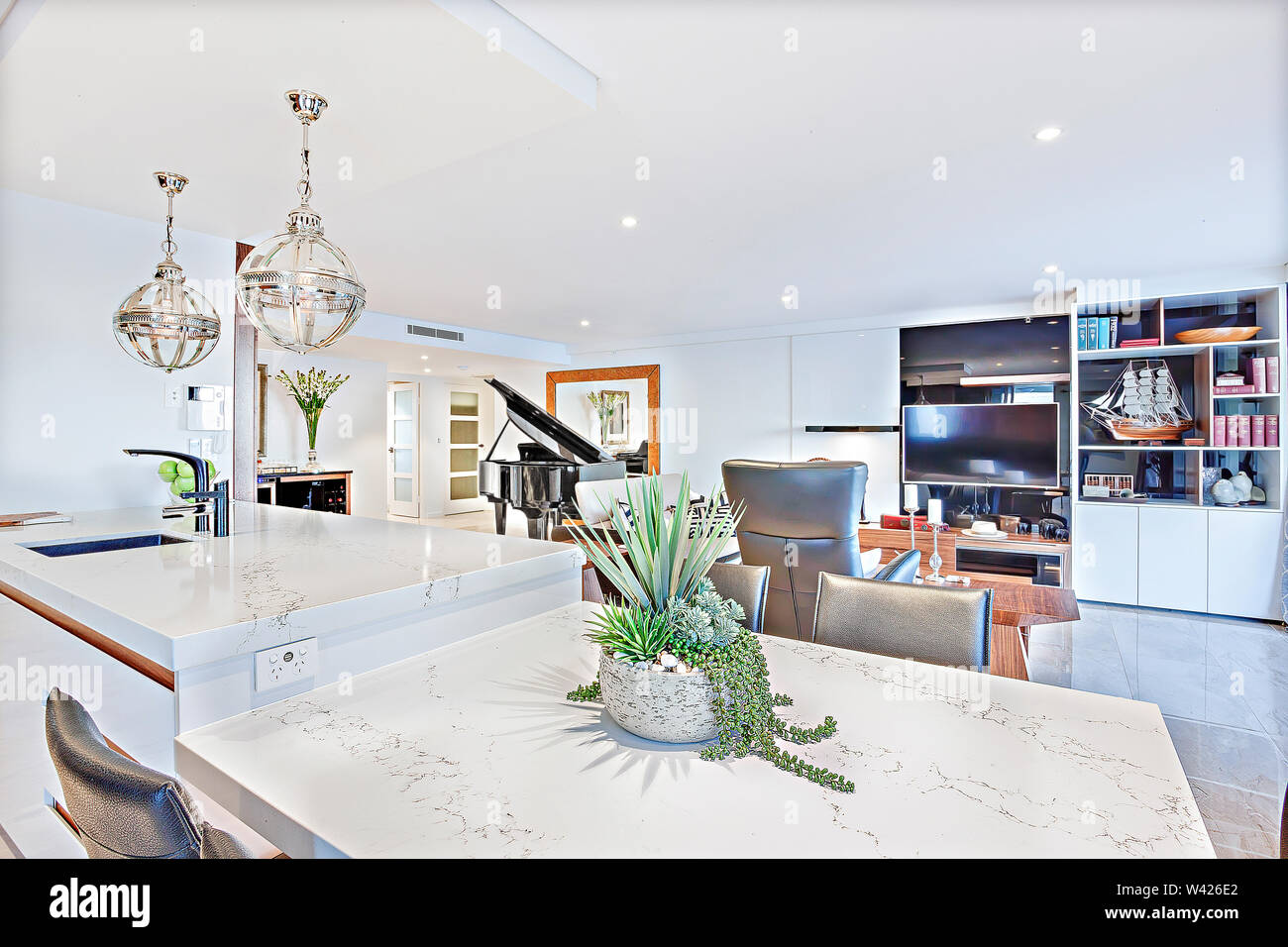 A simple dining table with a decorative piece on top Stock Photo - Alamy