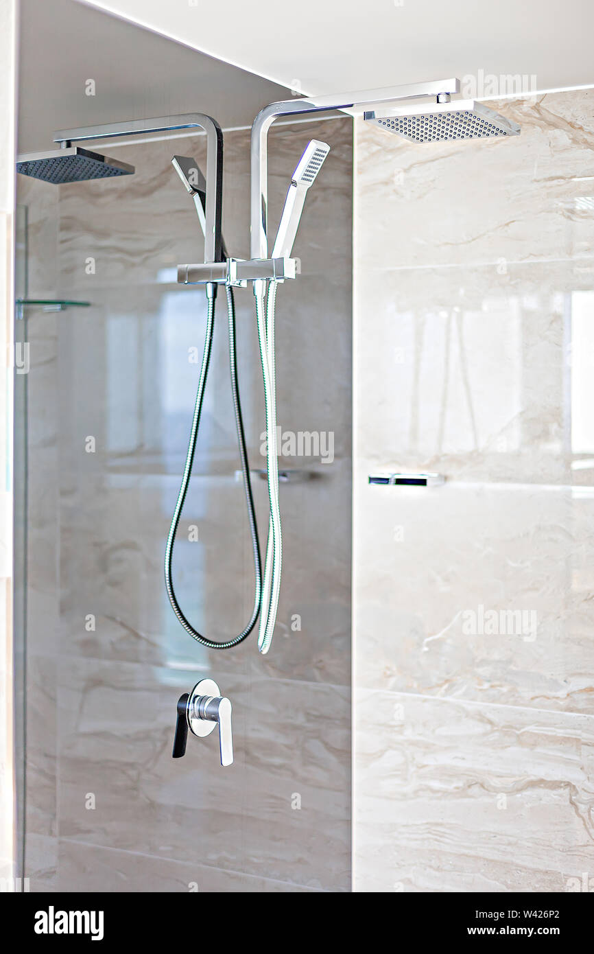 A functional shower area with tiled walls Stock Photo - Alamy