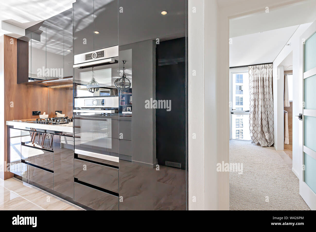 Splendid kitchen cabinetry adjoining the entrance to the bedroom Stock ...