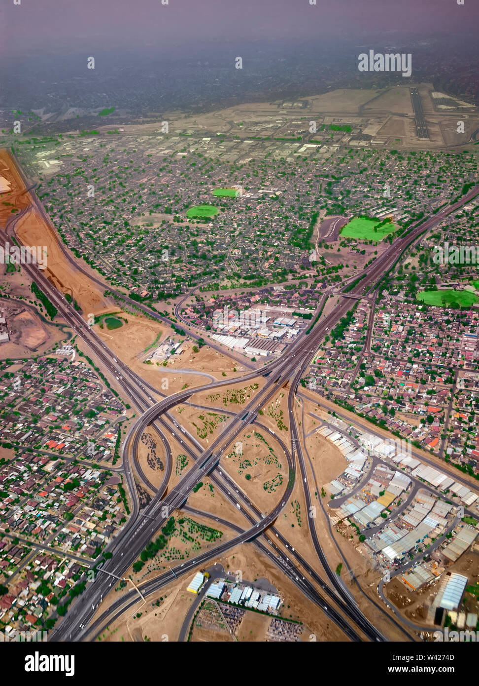 Image of a big city taken from high above; roads and many buildings can ...