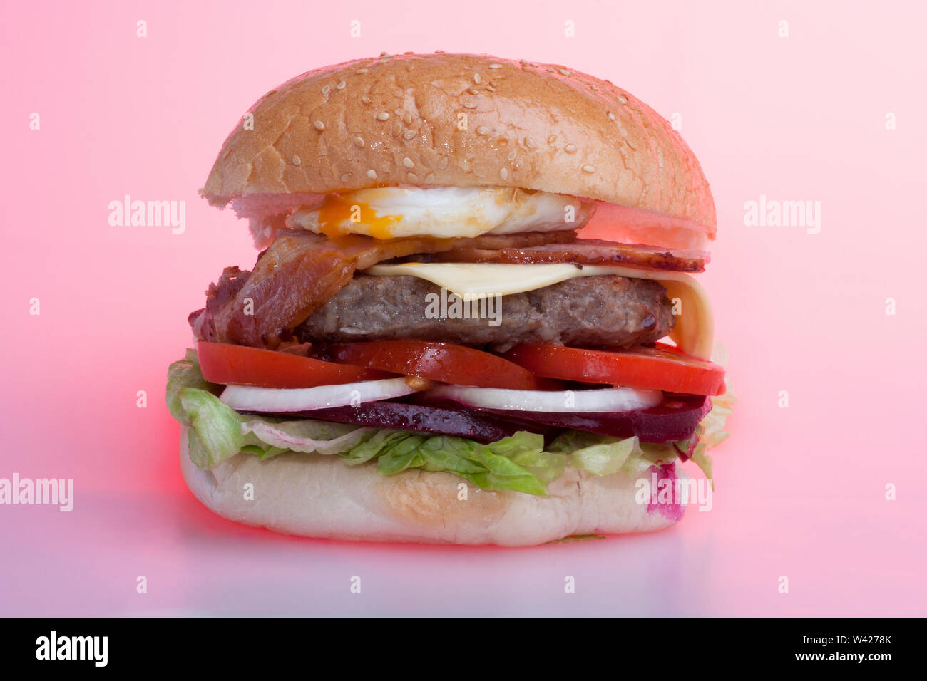 Shiny fish burger closeup view, hot burgers including meat and ...