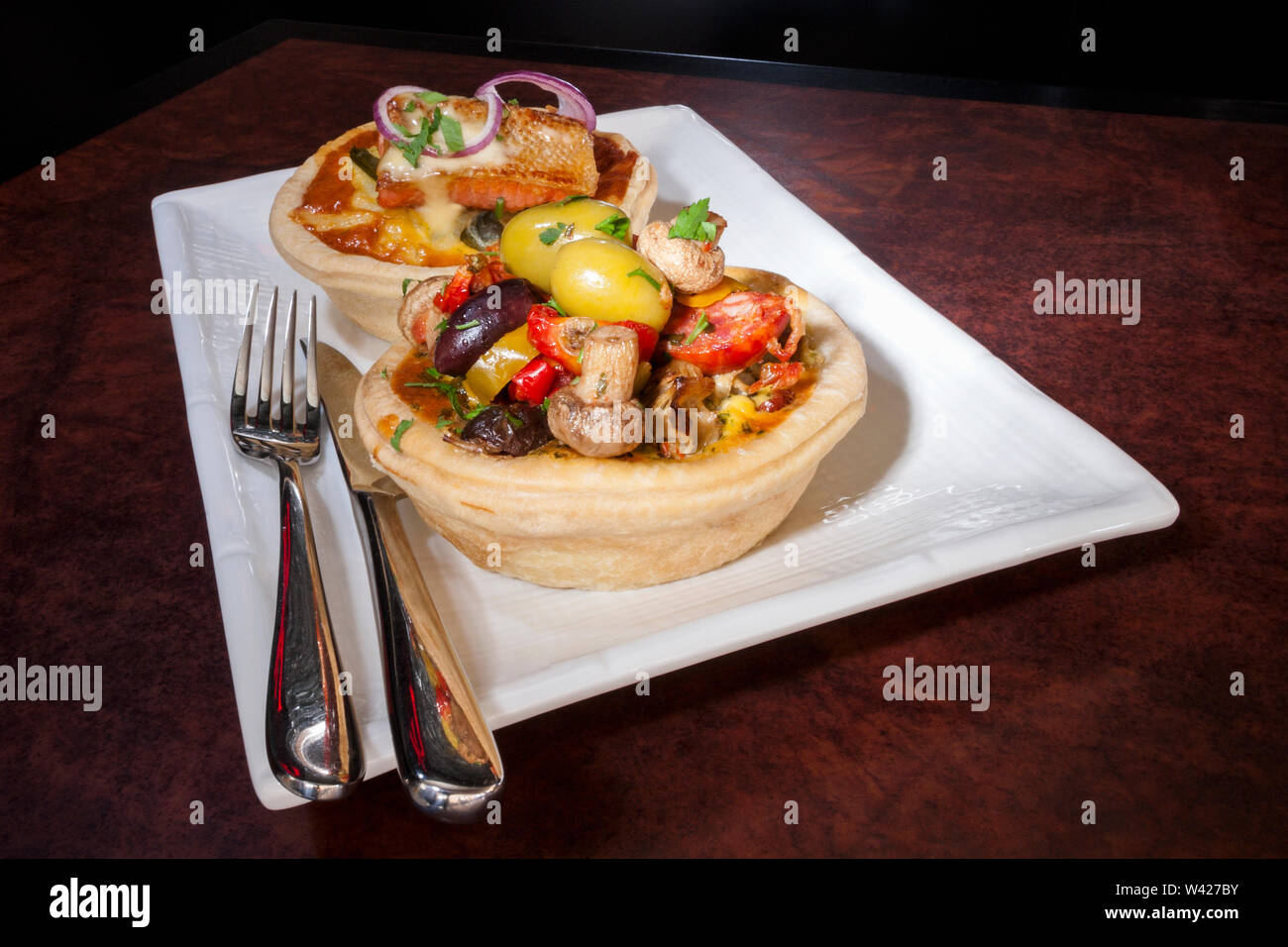 Fried burger with fruits and spoon, hot food including meat and ...