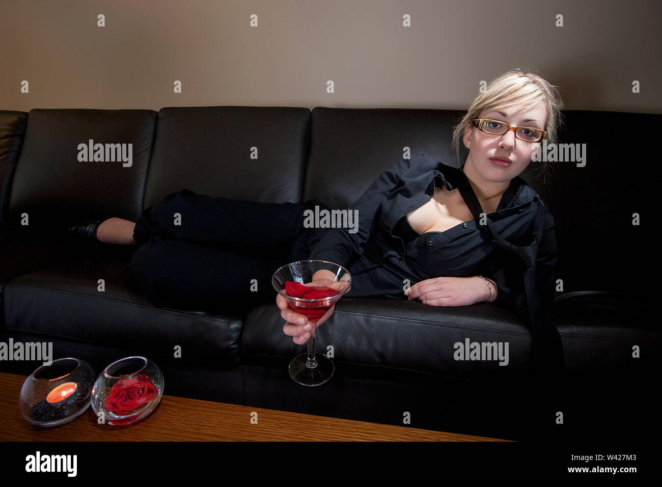 Black laying sofa eating hi-res stock photography and images - Alamy