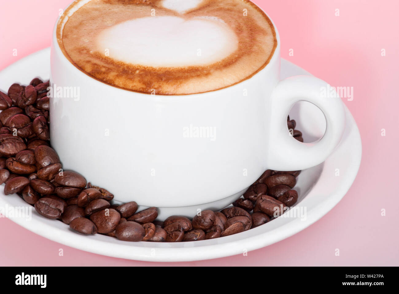 Side view of a fresh milk coffee, white color cup and background ...